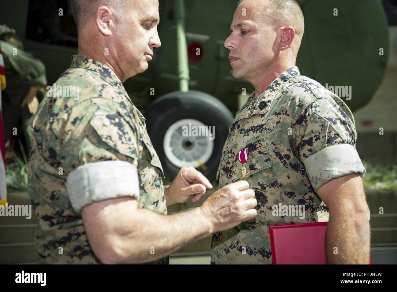 U.S. Marine Corps Lt. Col. Richard Owens, left, assistant program ...