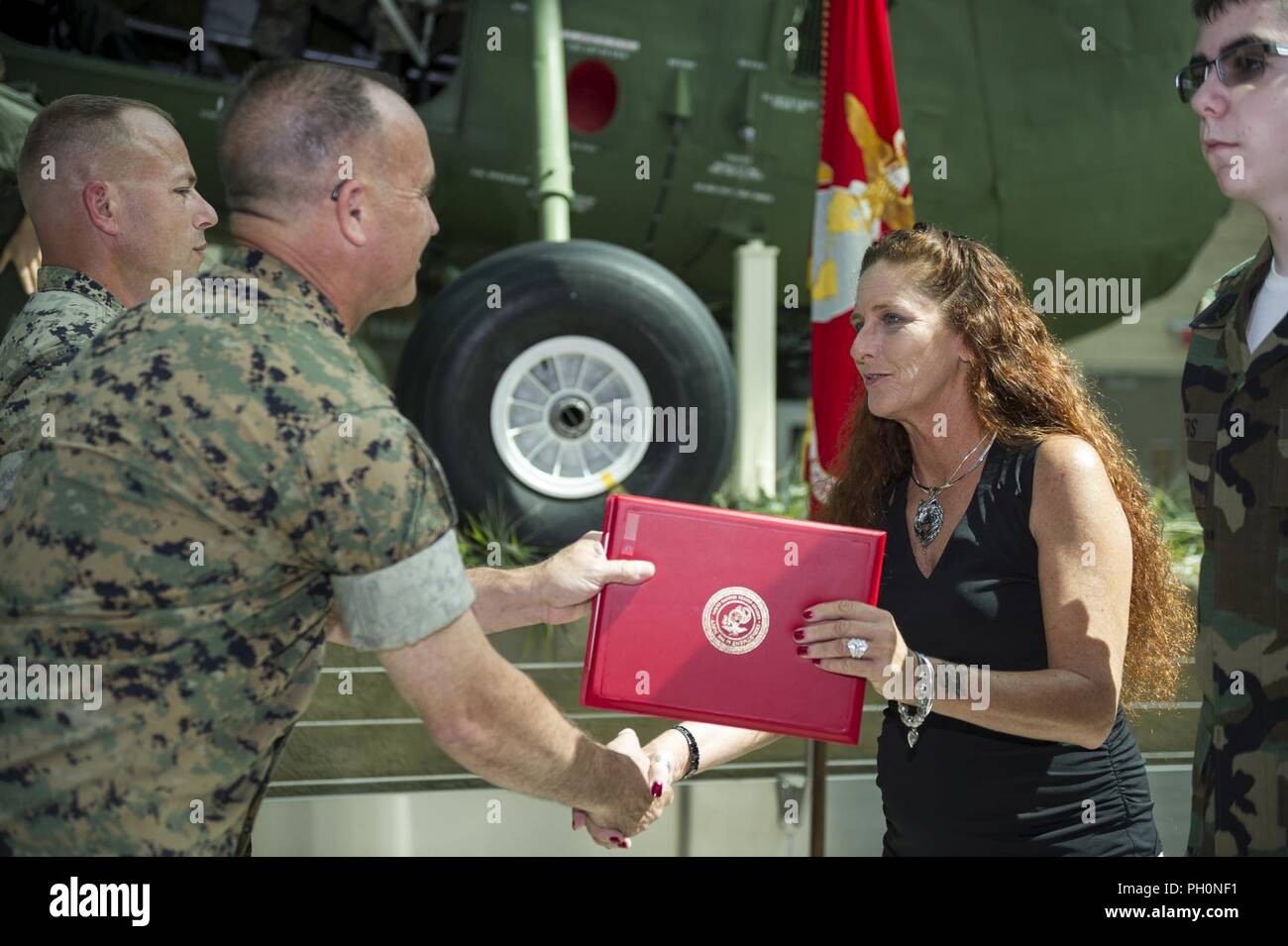 U.S. Marine Corps Lt. Col. Richard Owens, left, assistant program ...