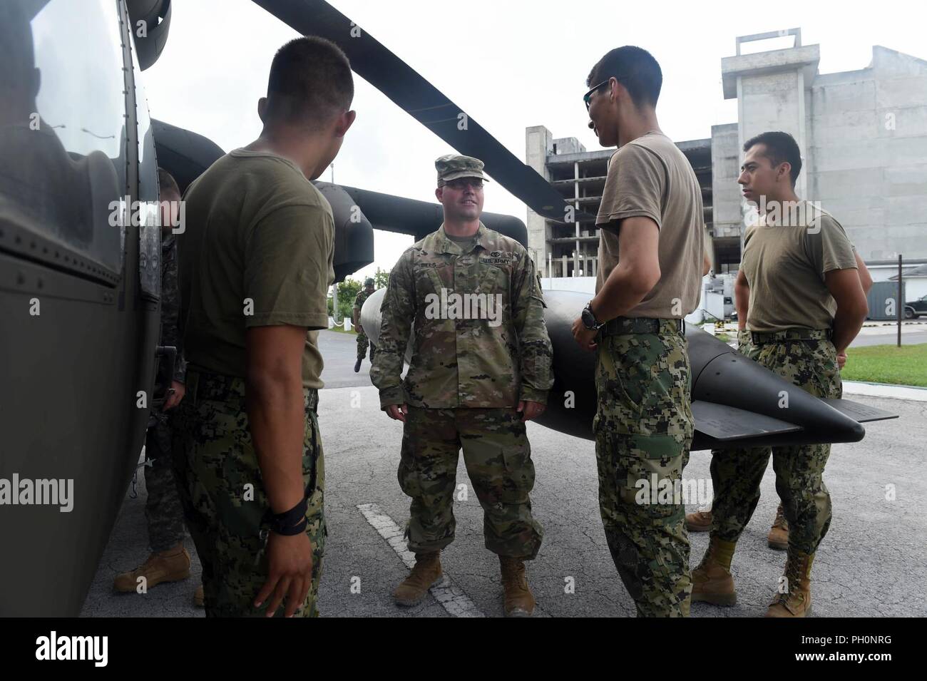 Bahamas (June 17, 2018) U.S. Army Sgt. Jeramy Bills (center), assigned ...