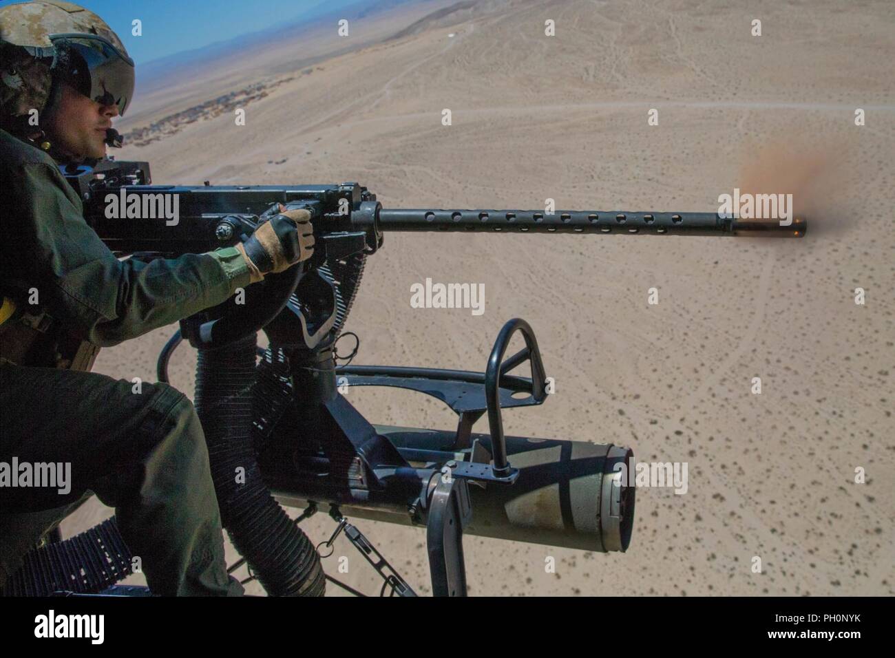 Sgt. Reyes Macedo, a helicopter crew chief with Marine Light Attack ...