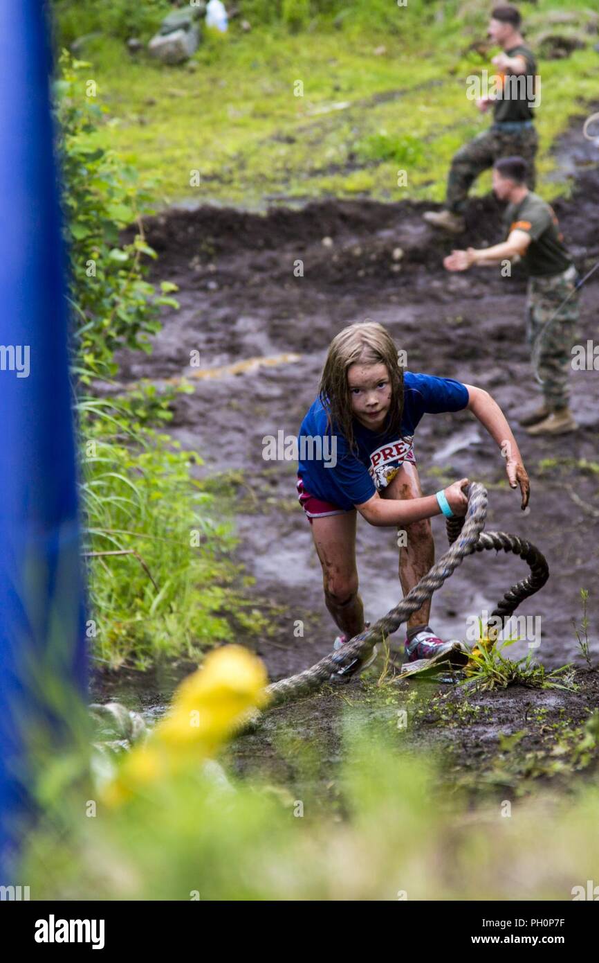 CAMP FUJI, SHIZUOKA, Japan- A child climbs up the final hill of the ...