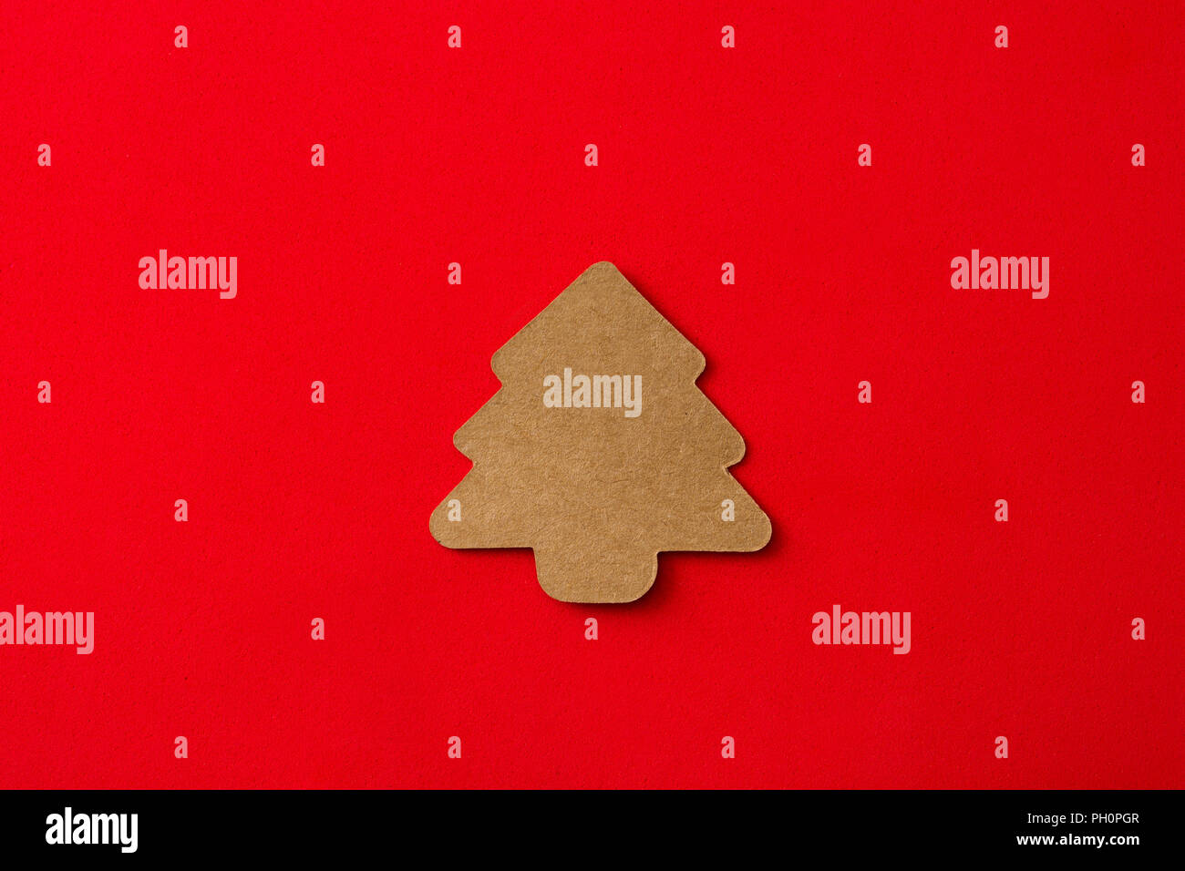 Christmas tree label on red background Stock Photo - Alamy