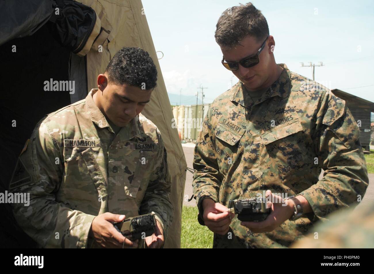 U.S. Army Staff Sgt.Tyrone Hamilton, left, the forward support ...