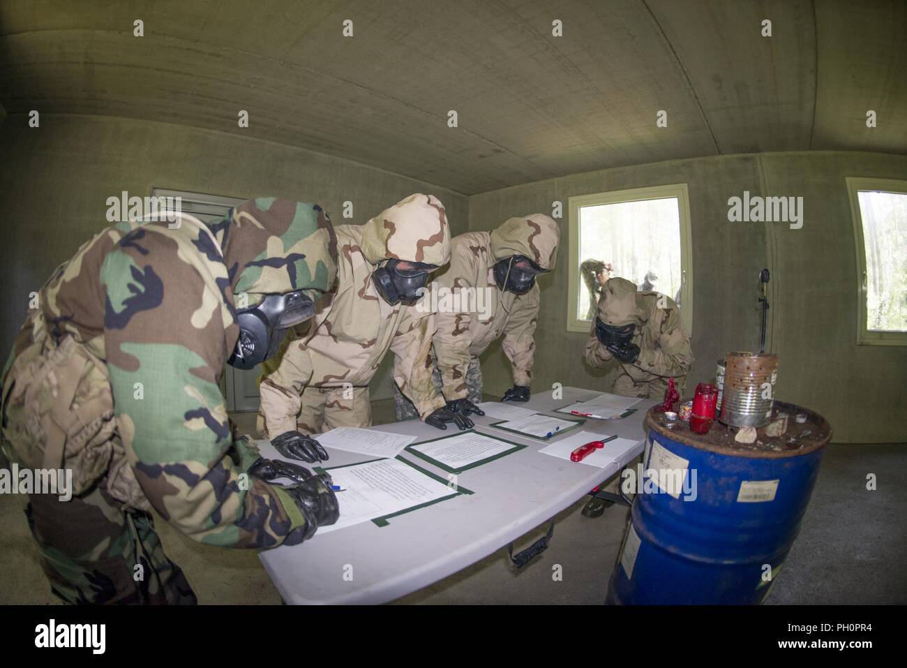 Competitors fill out an NBC report while in mission oriented protective ...