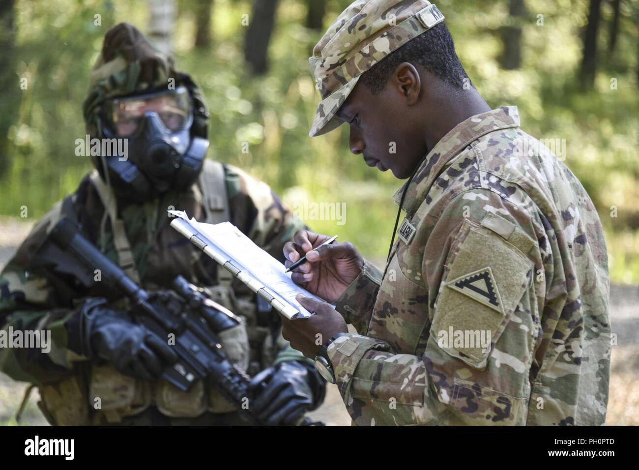 U.S. Army Sgt. Kemontavious Knight, right, with 1st Battalion, 4th ...