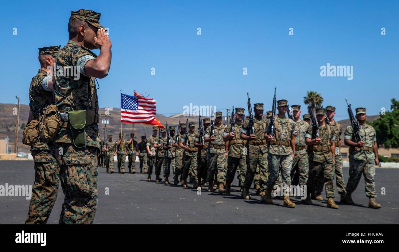 U.S. Marine Corps Maj. Arun Shankar, left, incoming commanding officer ...