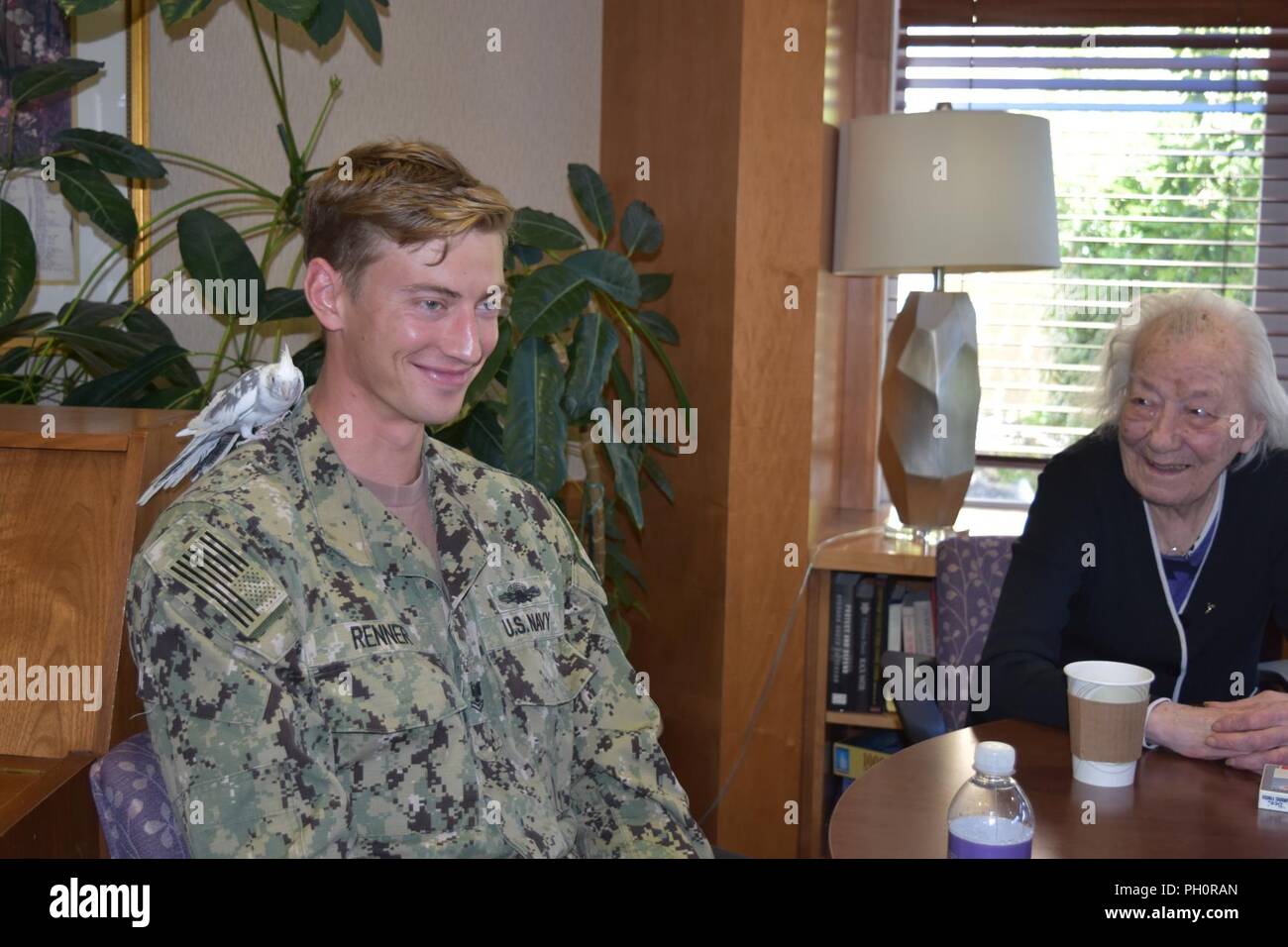 Navy Diver Second Class Adam Renner of Hershey, PA lends a shoulder to ...