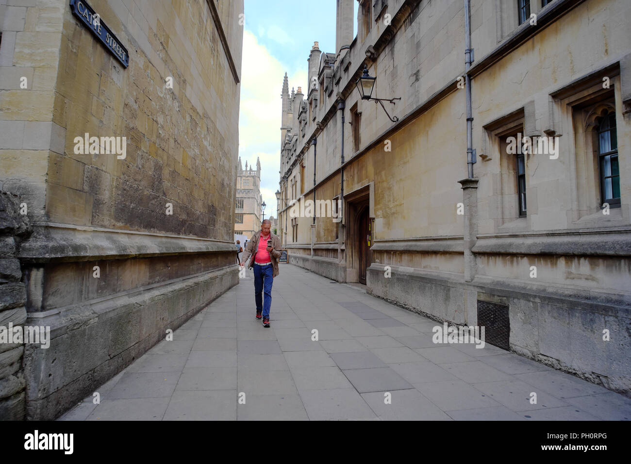 Man walking in Alleyway between two buildings, Oxford, Oxfordshire ...