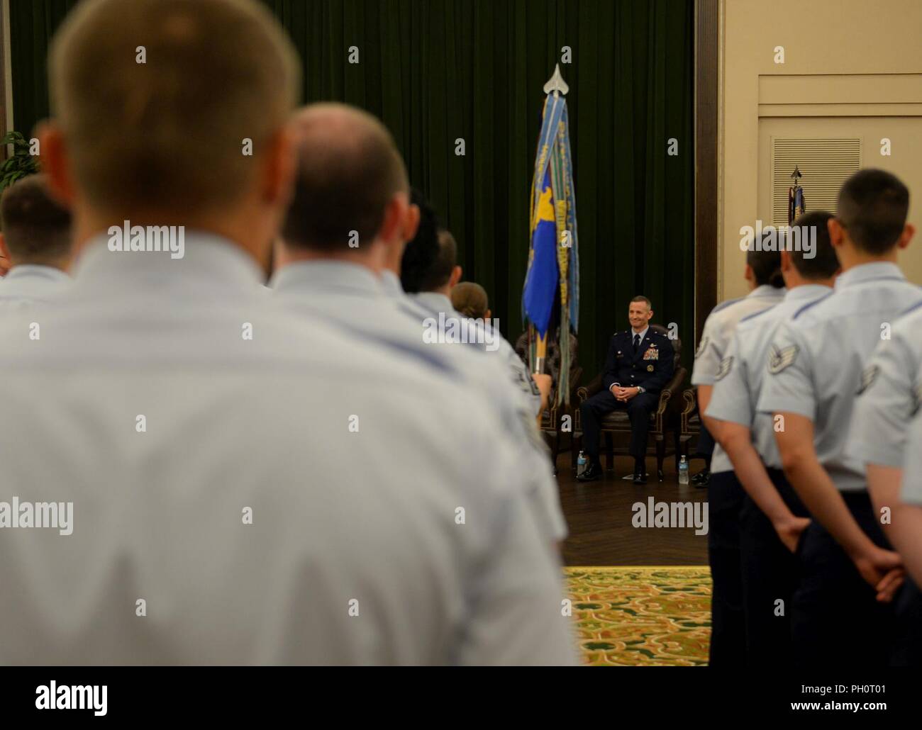 Col. Bradley Pyburn, 67th Cyberspace Wing commander, listens to Maj ...