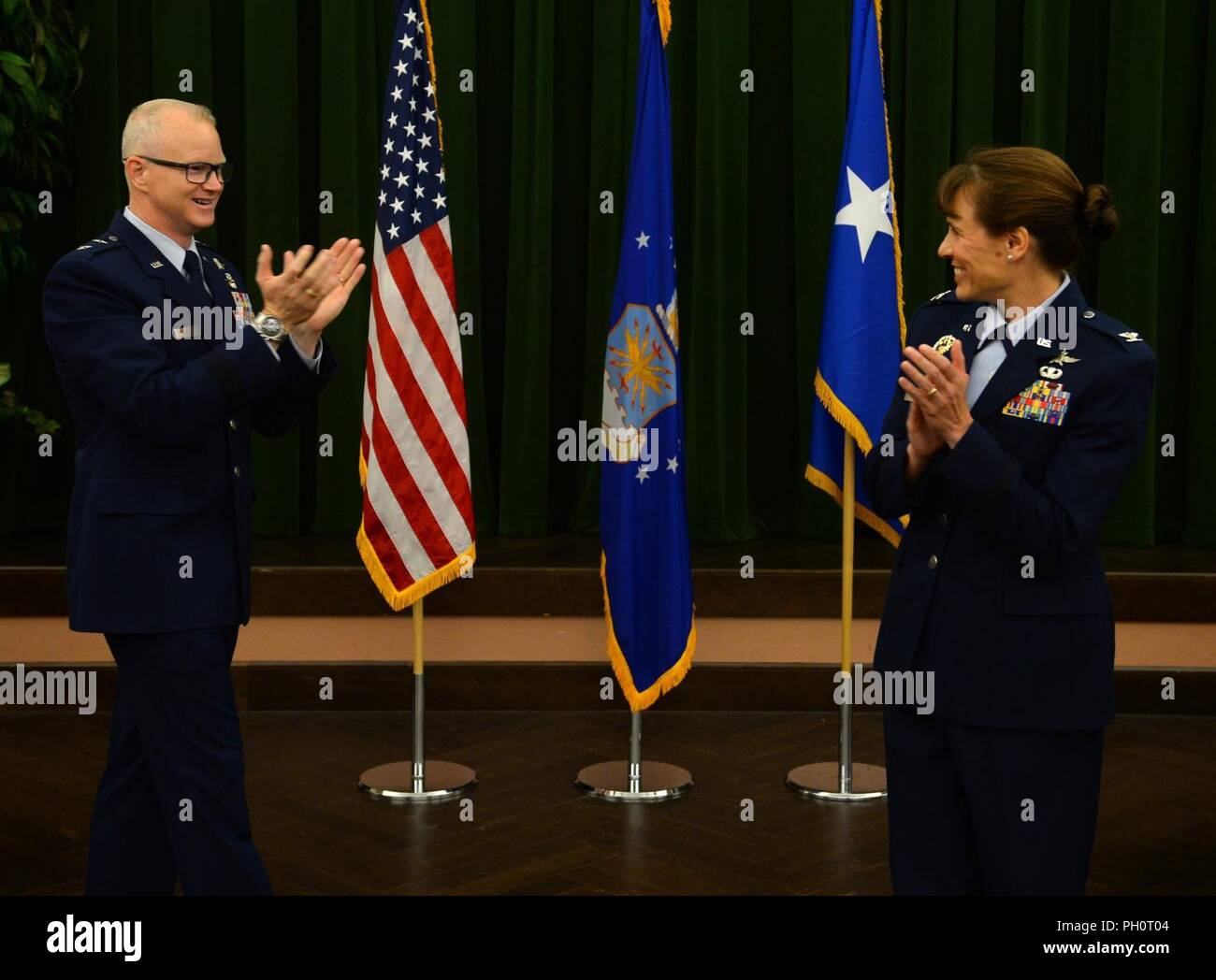 Maj. Gen. Chris Weggeman, Air Forces Cyber commander, congratulates Col ...