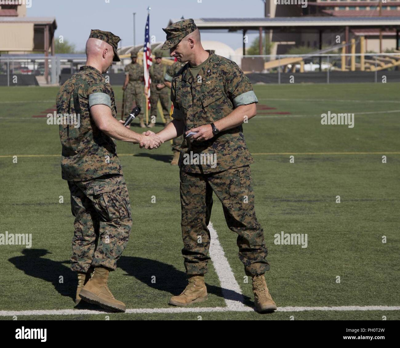 U.S. Marine Corps Lt. Col. Jayson M. Tiger shakes hands with Lt. Col ...