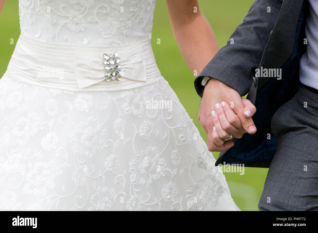 wedding couple holding hands Stock Photo - Alamy