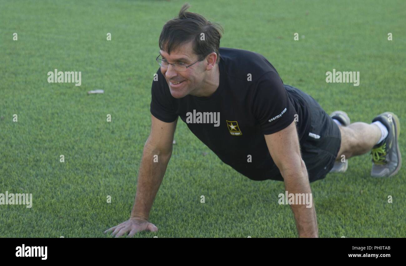 Secretary of the Army, Dr. Mark T. Esper, holds the front-leaning rest ...