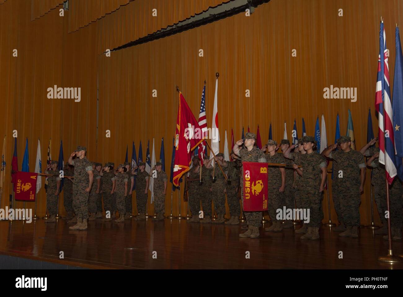 CAMP FOSTER, OKINAWA, Japan- Marines salute for national anthem during ...