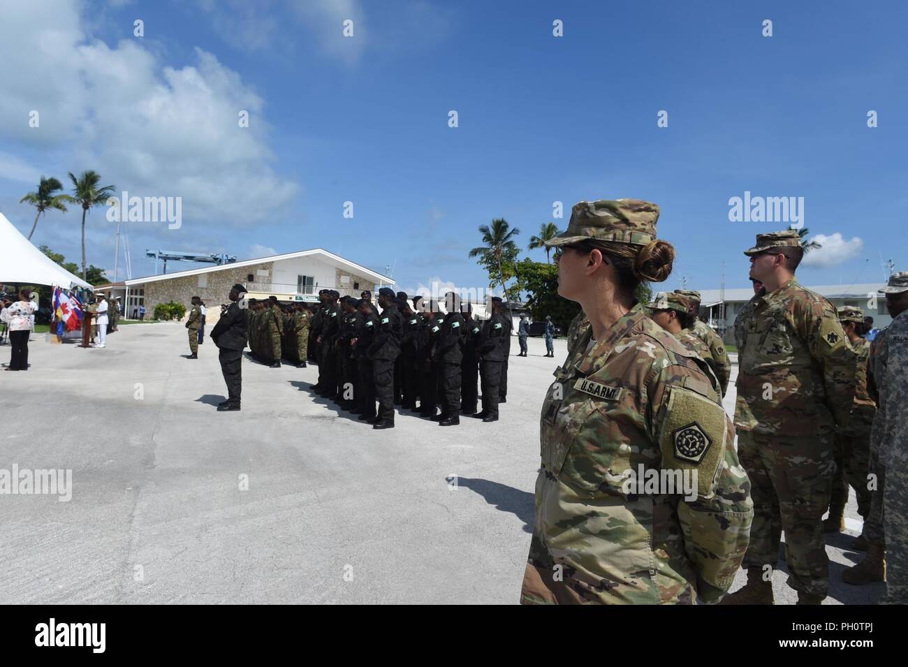 HARBOUR (June 20, 2018) Joint and multinational servicemembers stand in ...