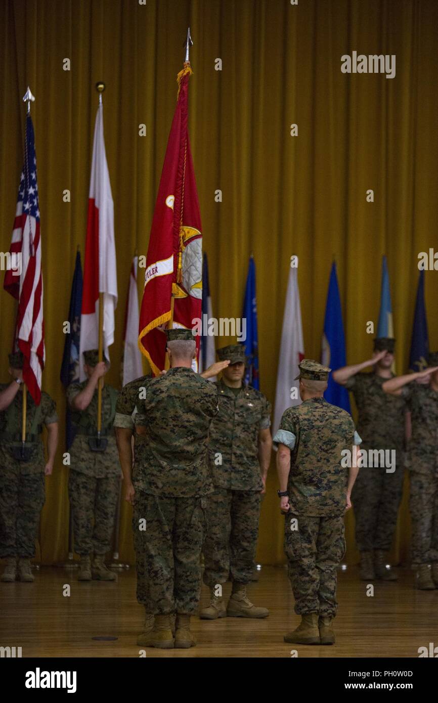 CAMP FOSTER, OKINAWA, Japan – Col. Vincent J. Ciuccoli holds the Colors ...