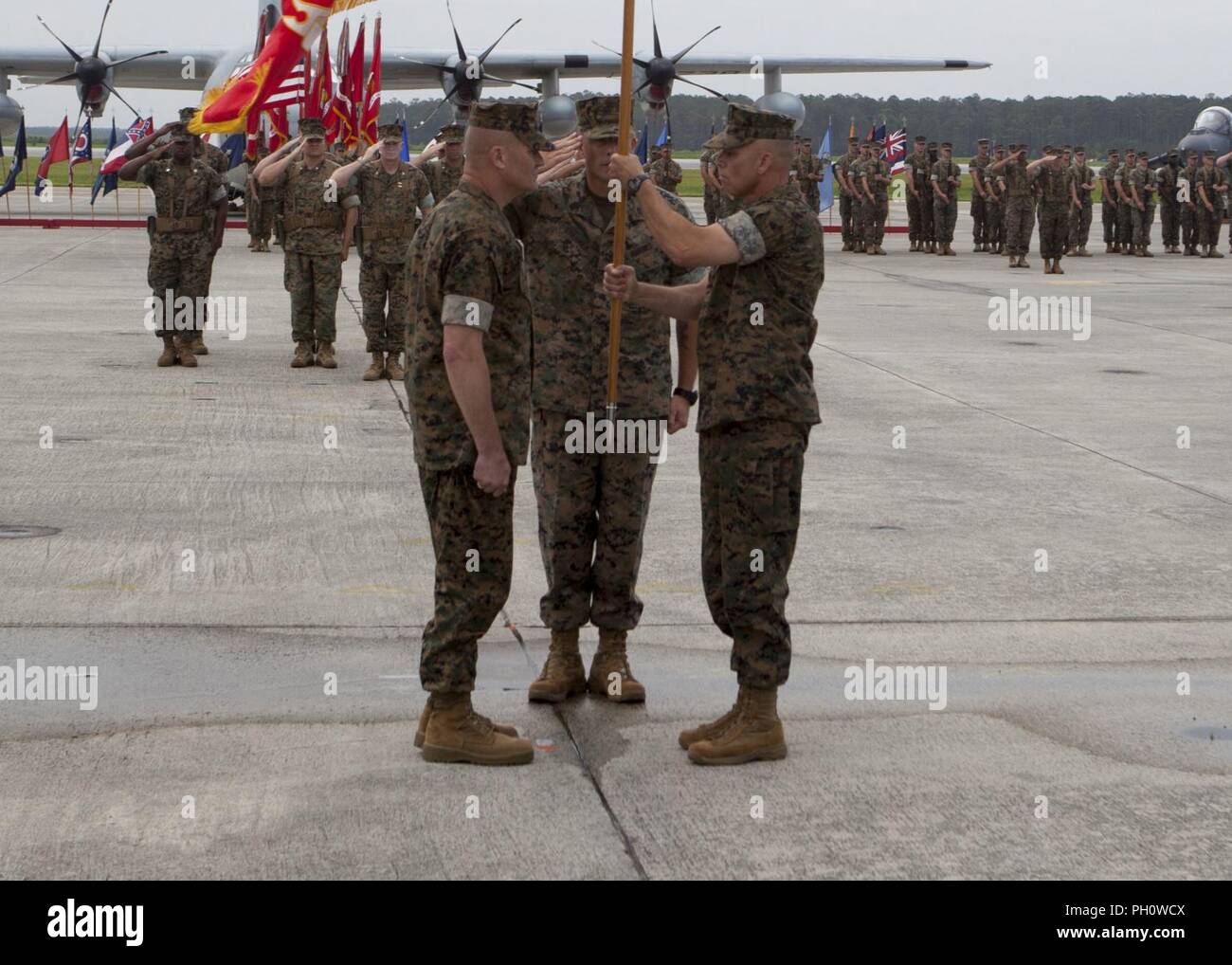 U.S. Marine Corps Maj. Gen. Matthew G. Glavy, right, passes the unit ...