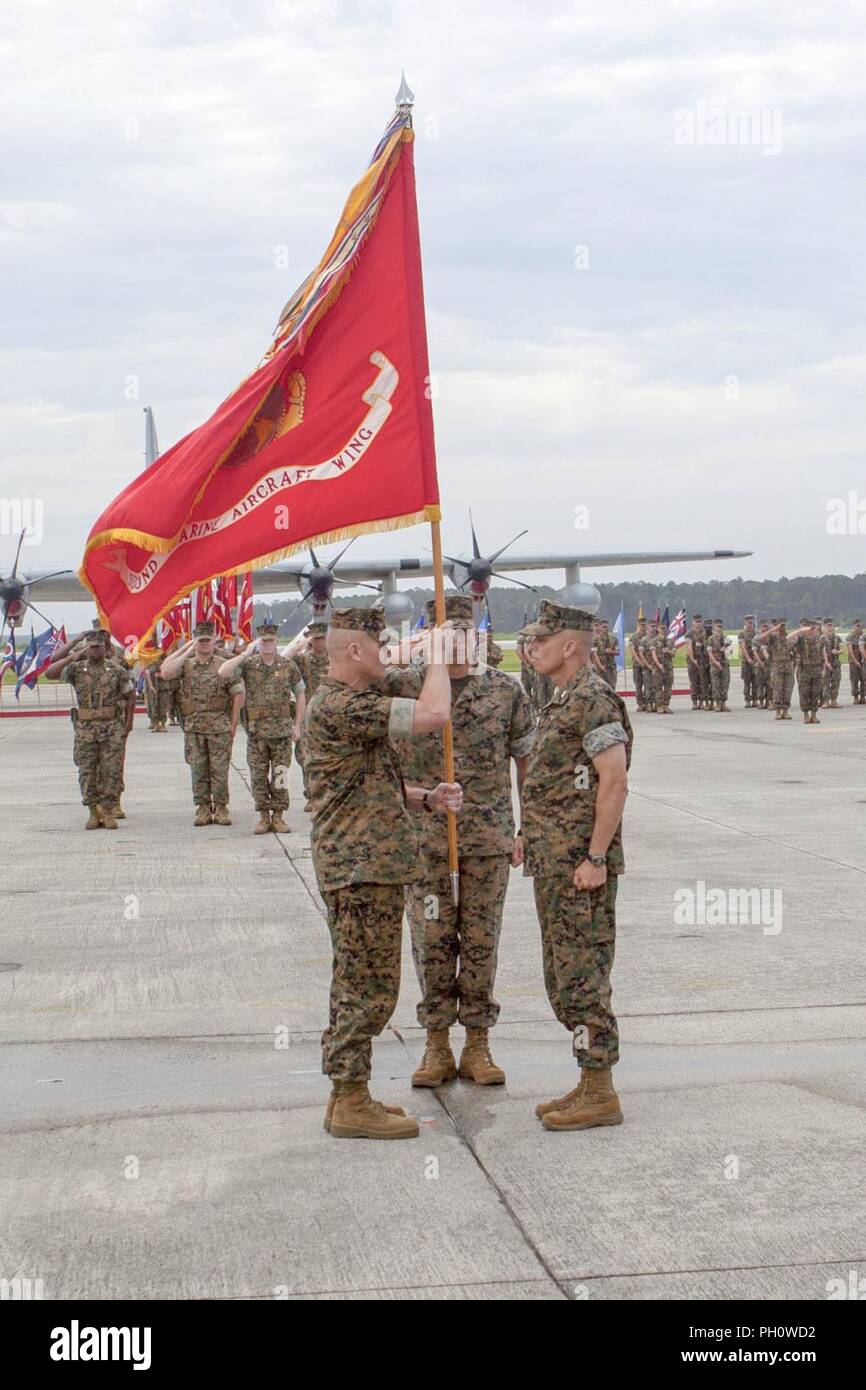 U.S. Marine Corps Maj. Gen. Matthew G. Glavy, right, passes the unit ...