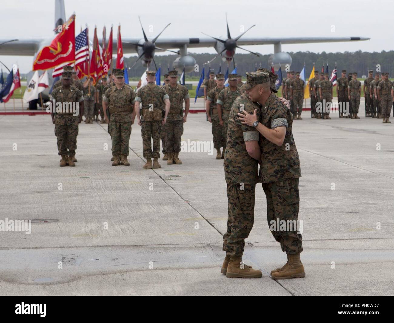 U.S. Marine Corps Brig. Gen. Karsten S. Heckl, left, shakes hands with ...