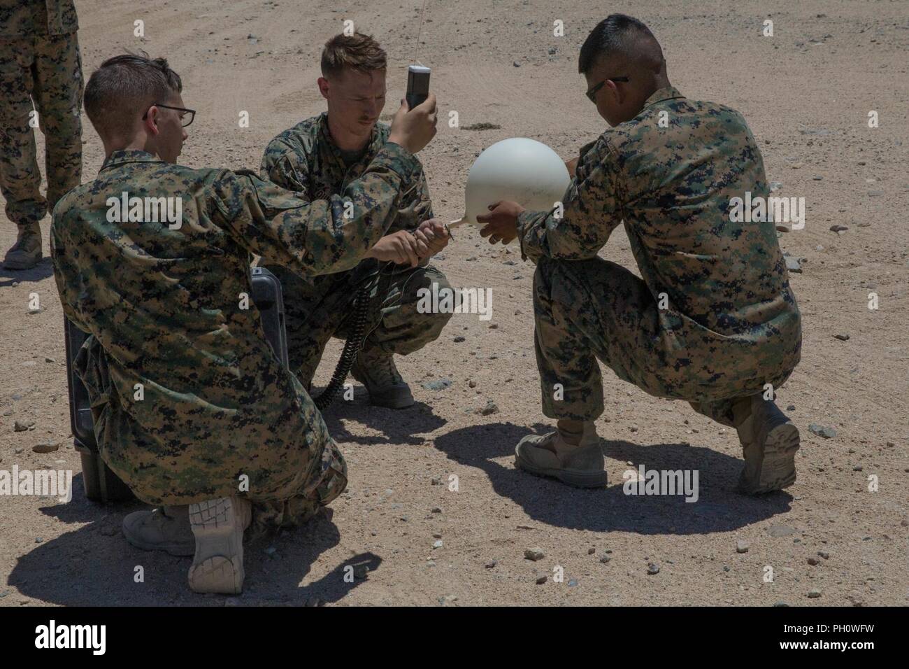 Meteorology and oceanography analyst forecast Marines with Detachment A ...