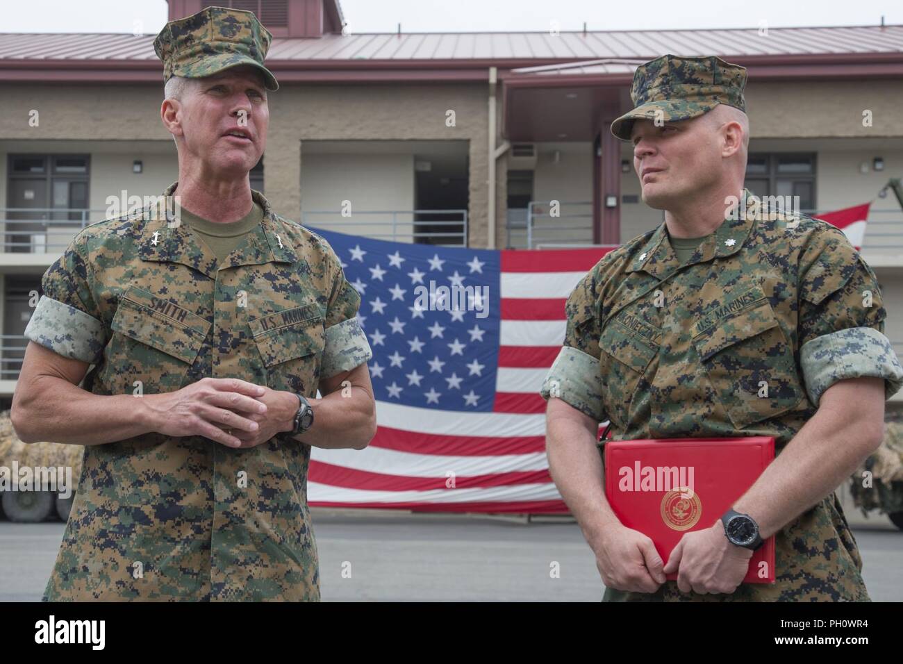 U.S. Marine Corps Maj. Gen. Eric M. Smith, left, the commanding general ...