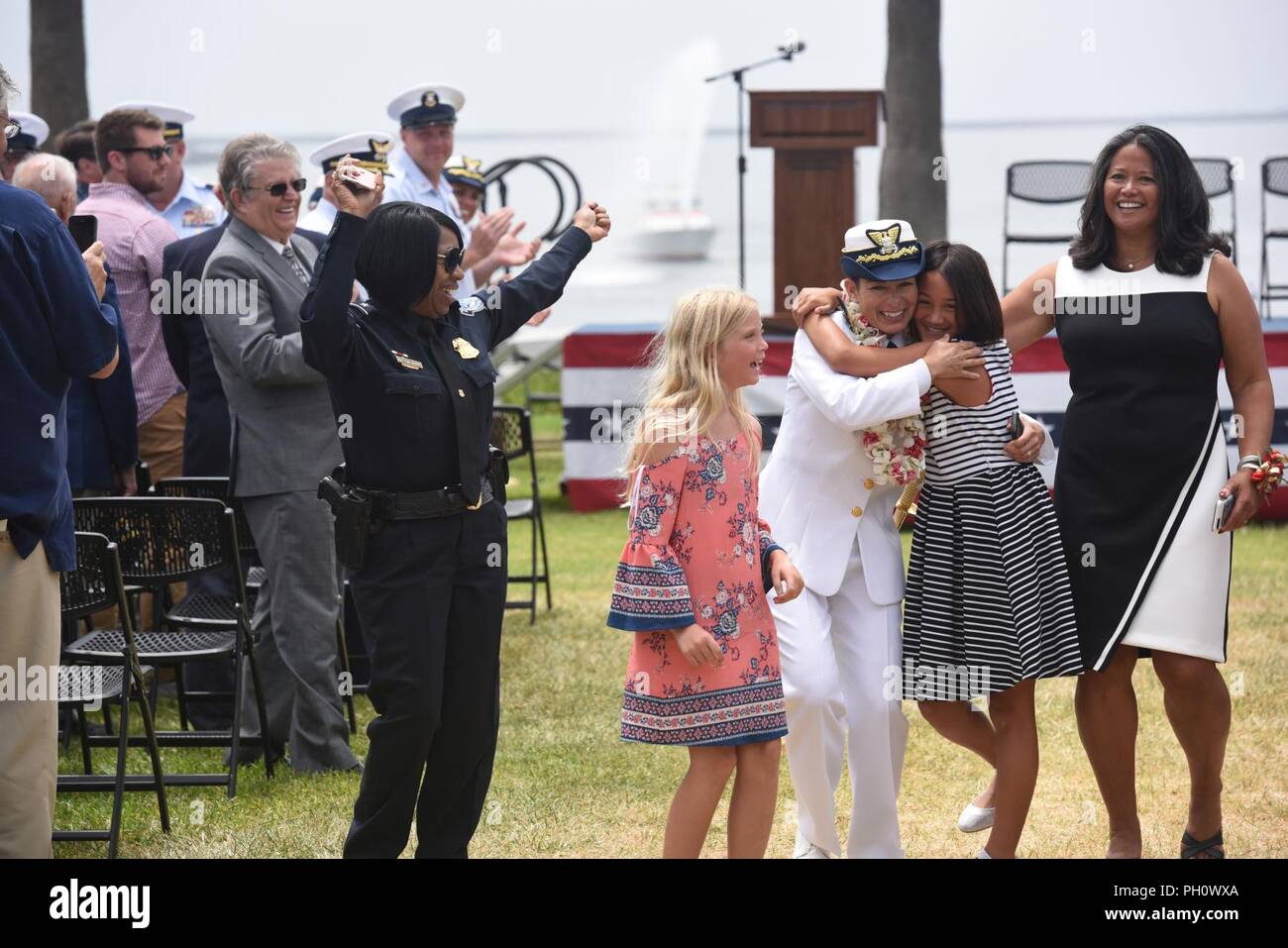 Capt. Charlene L. Downey celebrates with her wife and guests following ...