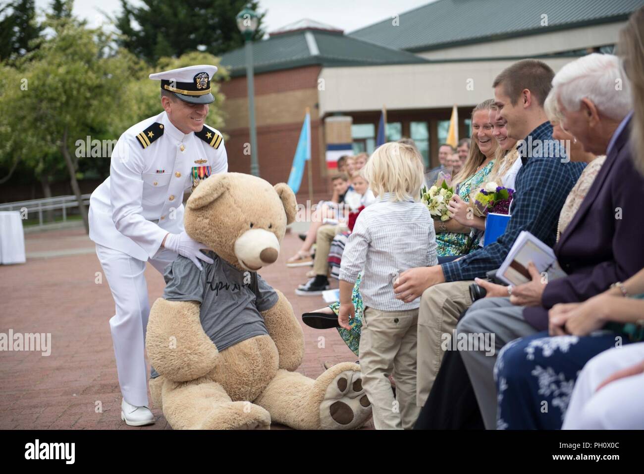 Everett, Wash. (June 22, 2018) Lt. John Pavlus presents a gift on ...