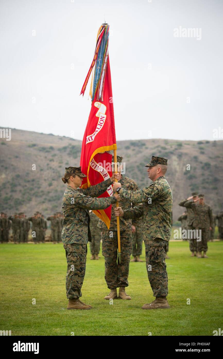 U.S. Marine Corps Lt. Col. Michelle I. Macander, left, incoming ...