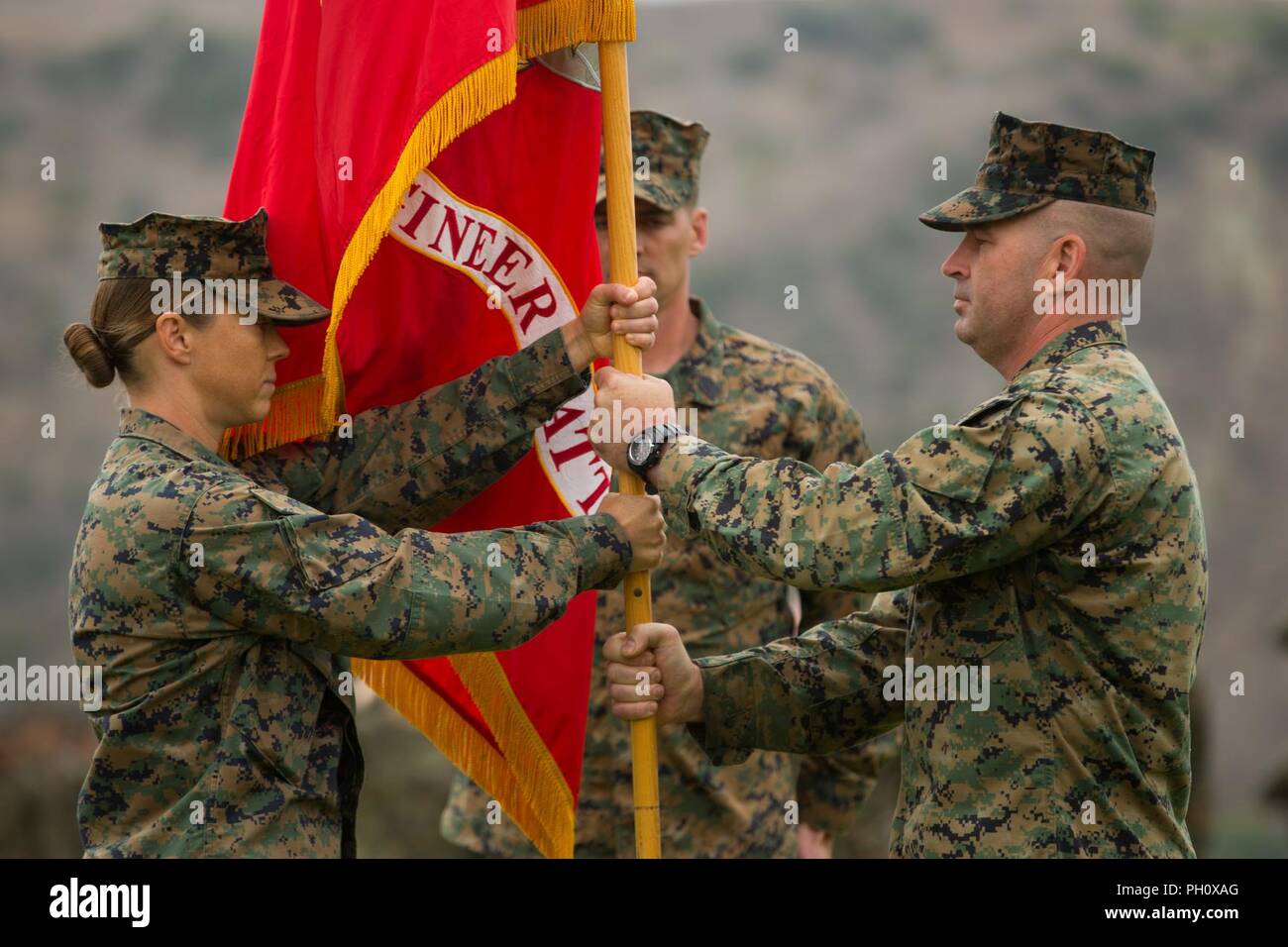 U.S. Marine Corps Lt. Col. Michelle I. Macander, left, incoming ...