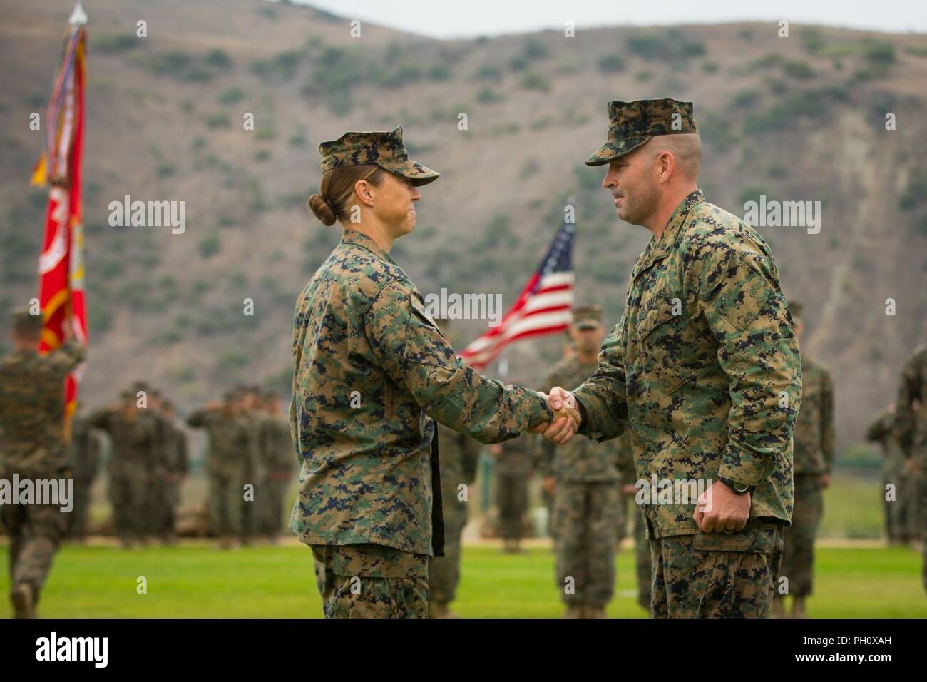 U.S. Marine Corps Lt. Col. Michelle I. Macander, left, incoming ...