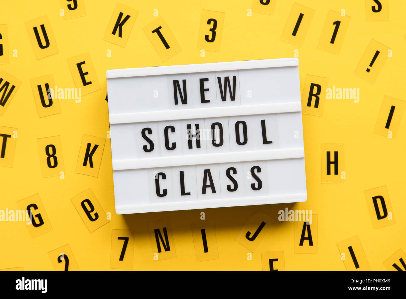 New school class lightbox message on a bright yellow background Stock ...