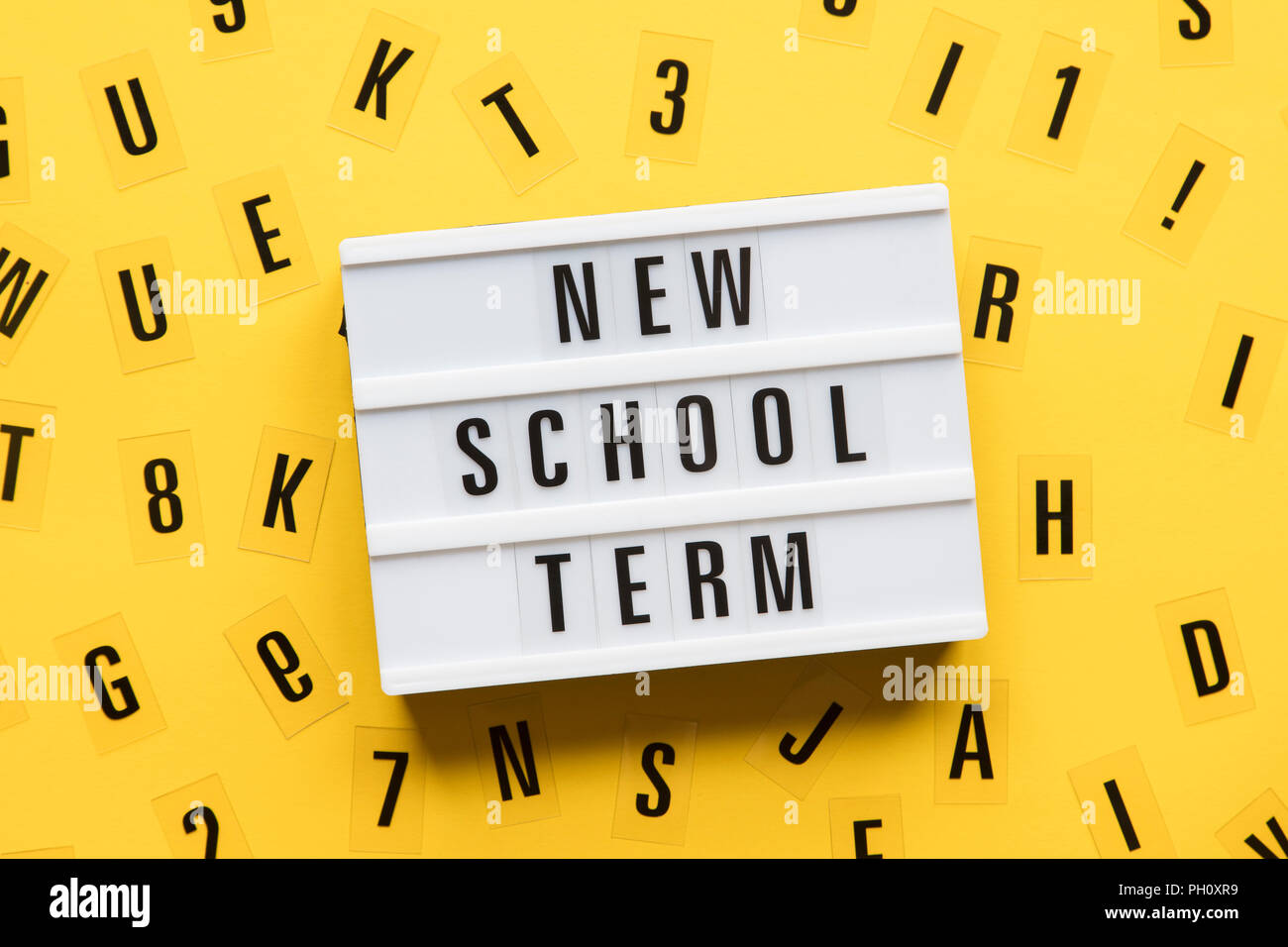 New school term lightbox message on a bright yellow background Stock ...