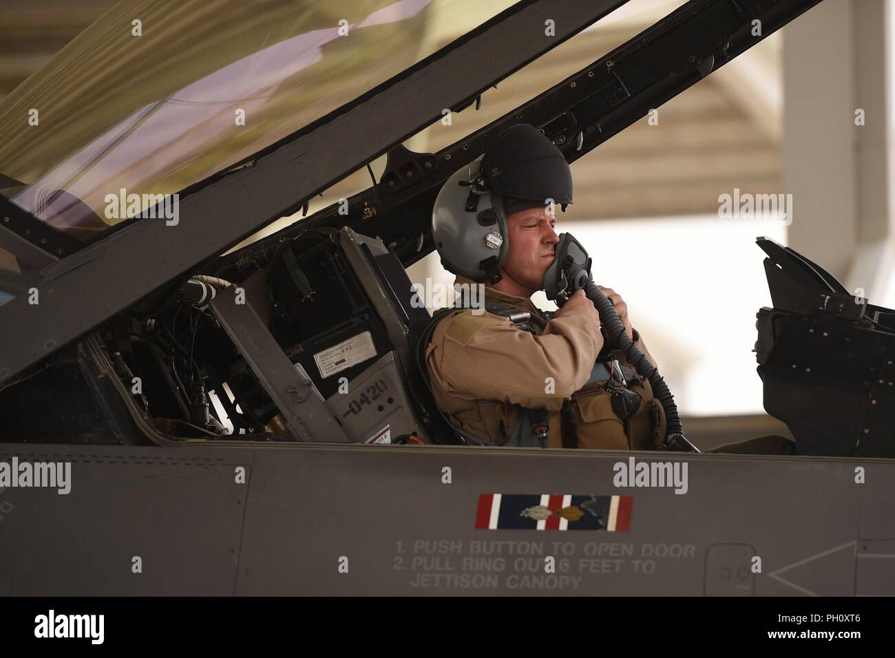 Col. Scott Gibson, 407th Air Expeditionary Group commander, sits in the ...
