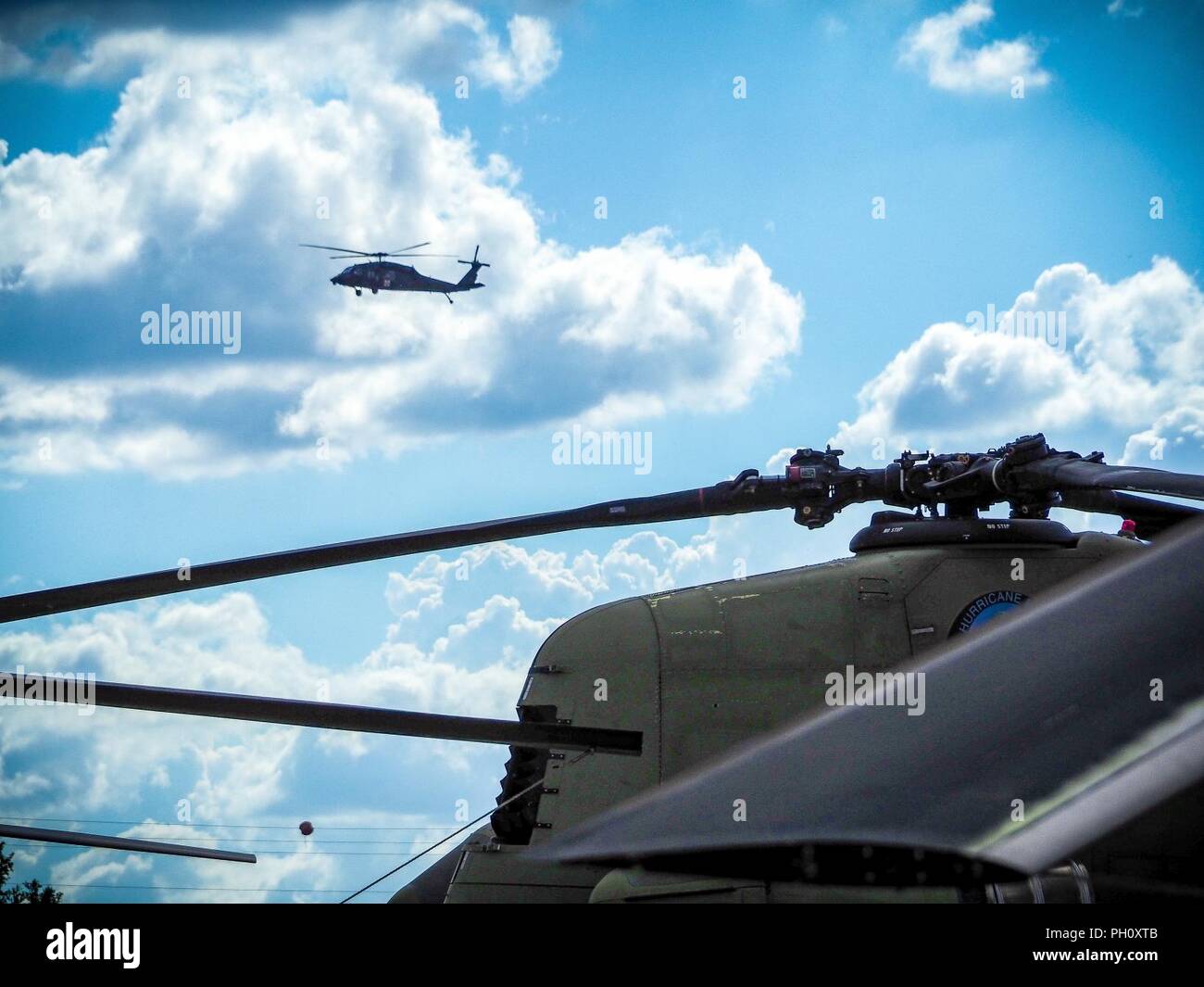A Black Hawk helicopter preparing for landing is visible in the ...