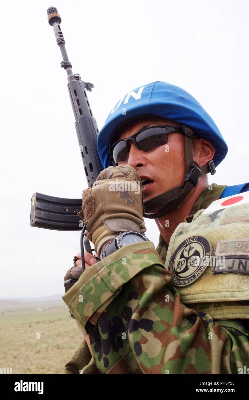 Japan Ground Self-Defense Force Sgt. 1st Class Naoki Kitamura radios ...