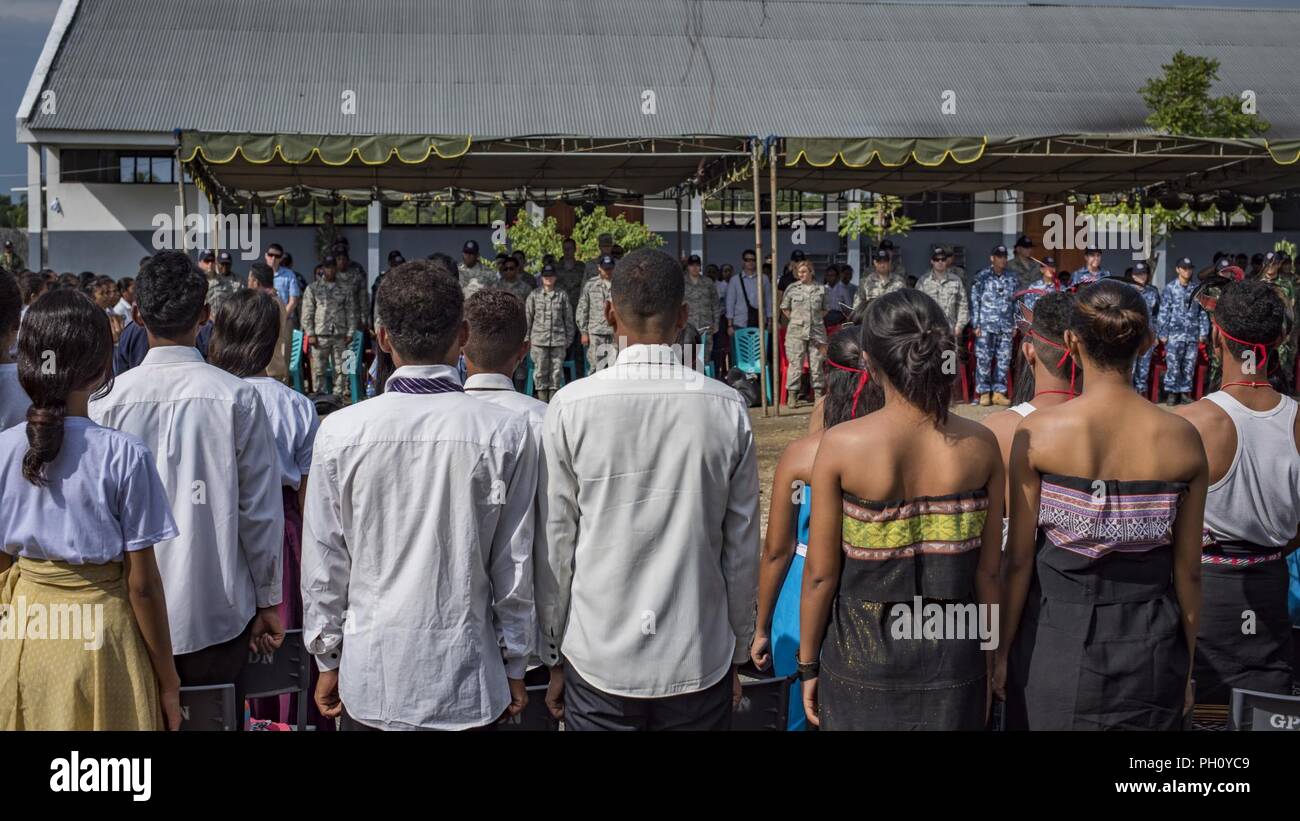 Timor-Leste students stand for the playing of their country’s national ...