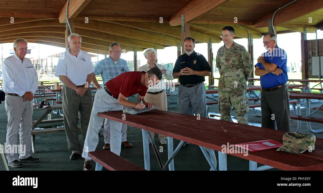 Eddie Somers, president, Smith Island United, signs a piece of jetty ...