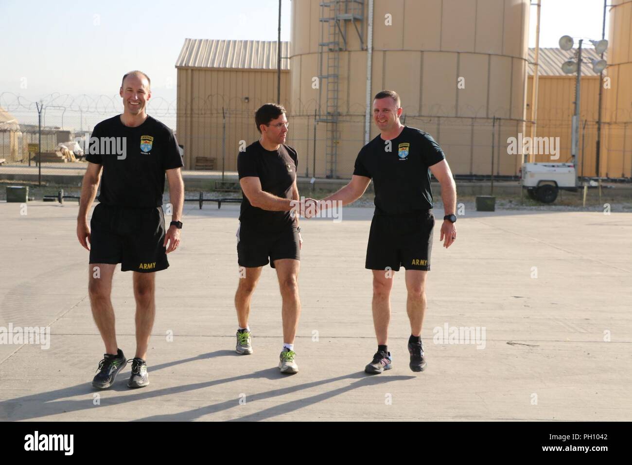 Secretary of the Army Dr. Mark T. Esper (center) greets Command Sgt ...