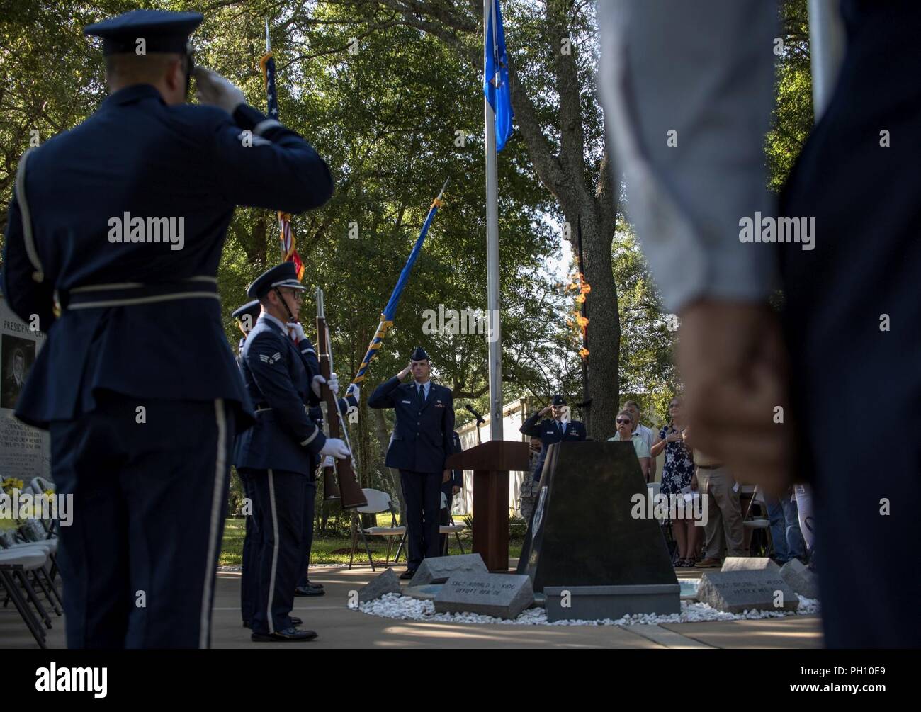 Airmen from the Eglin Air Force Base Honor Guard present the colors ...