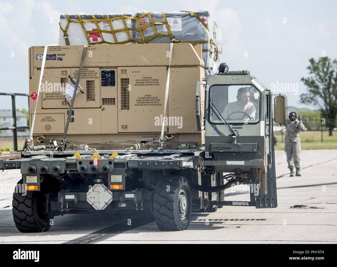 Airmen with the 375th Logistics Readiness Squadron transport pallets of ...