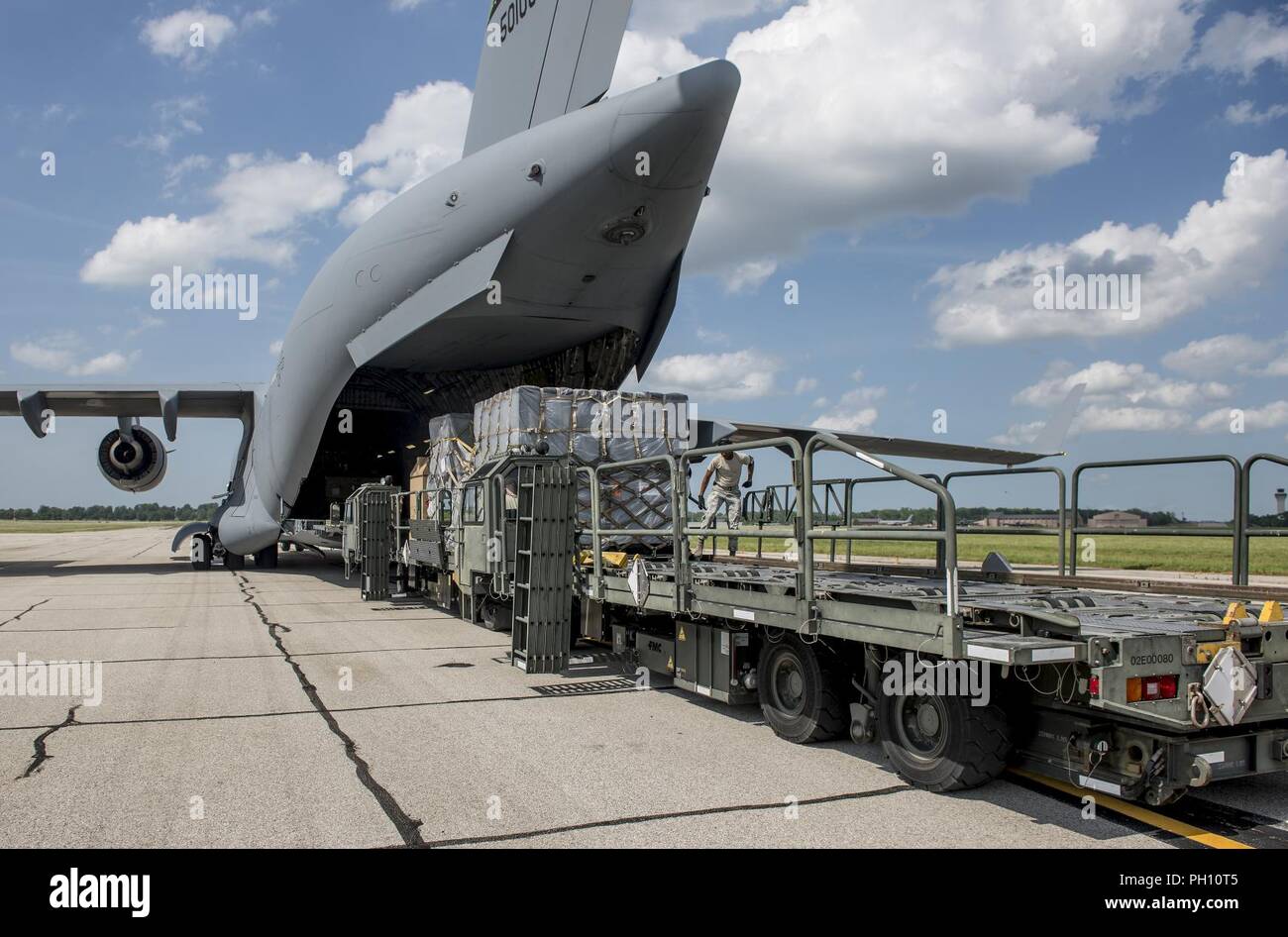 Airmen with the 375th Logistics Readiness Squadron unload pallets of ...