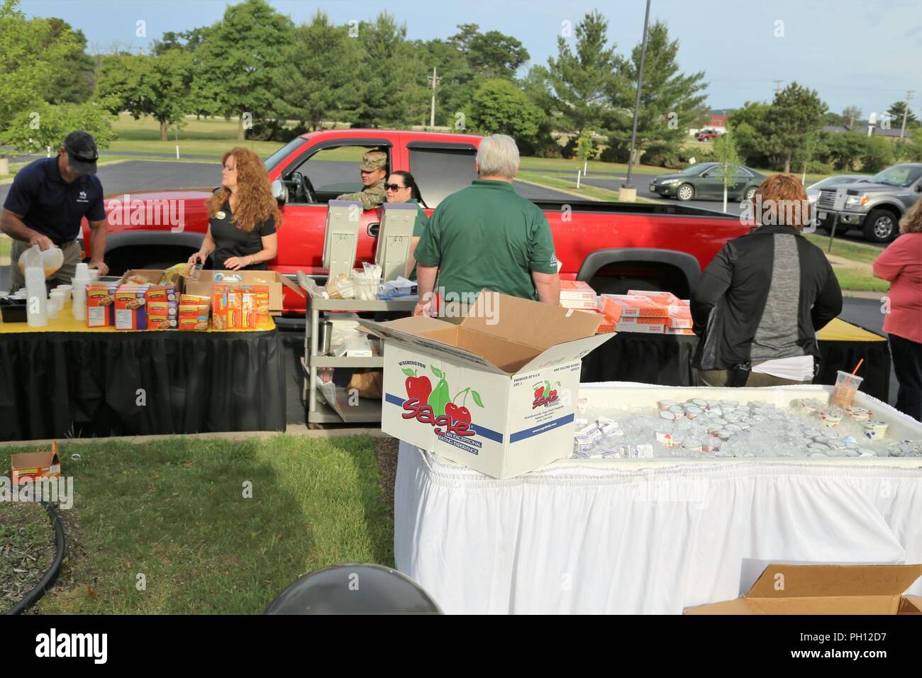 Fort McCoy, Wis., community members line up for a free drive-thru ...