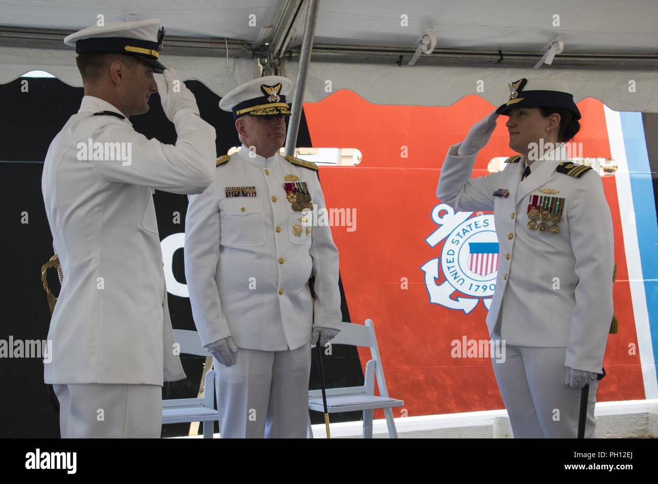 Lt. Cmdr. Margaret Kennedy (right) assumes command of the Coast Guard ...