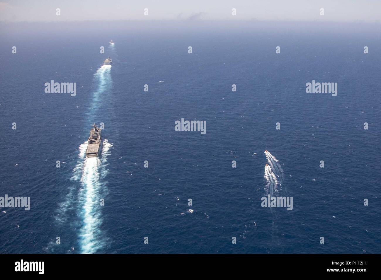 ATLANTIC OCEAN (June 24, 2018) Simulated fast attack craft approach the ...