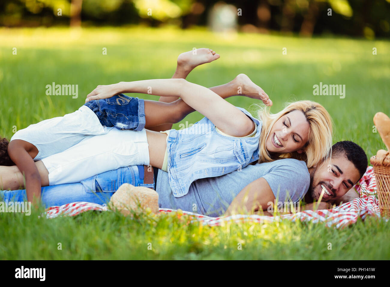Happy family having fun time on picnic Stock Photo - Alamy