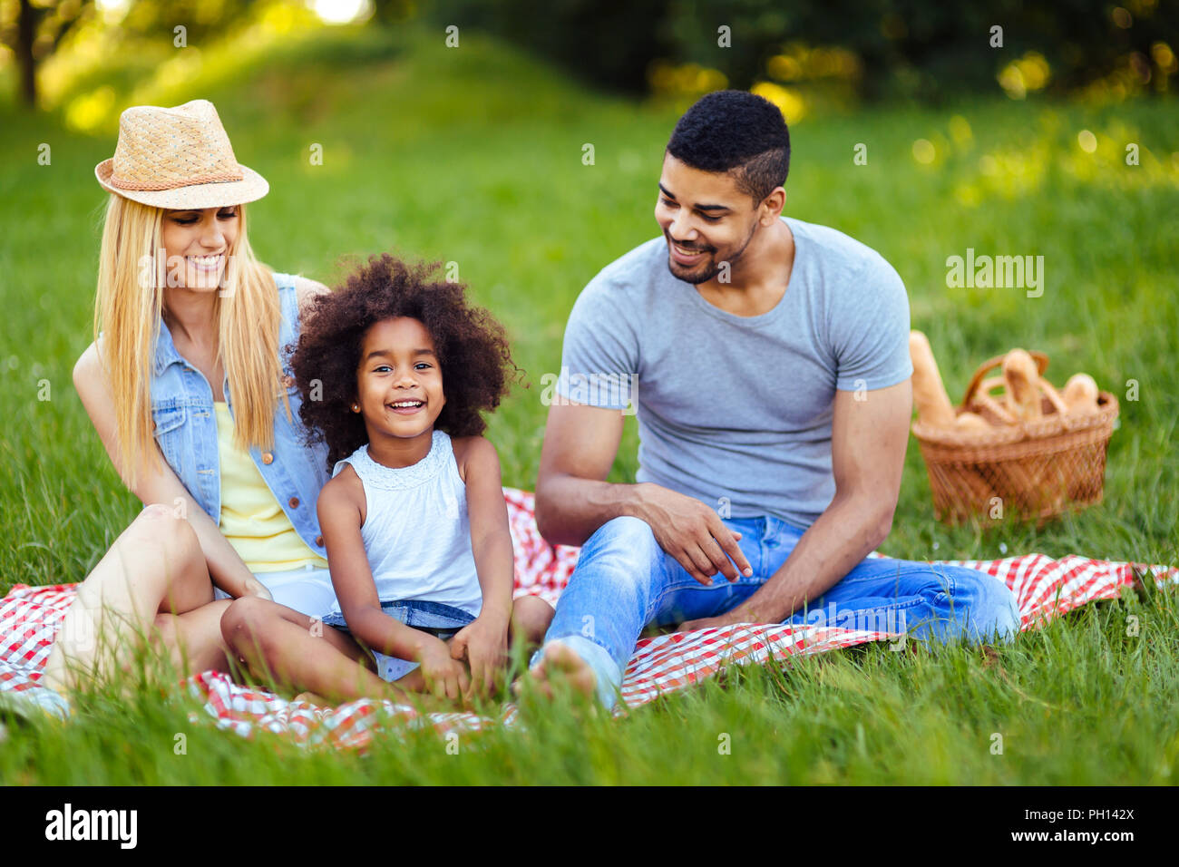 Picture of lovely couple with their daughter having picnic Stock Photo ...