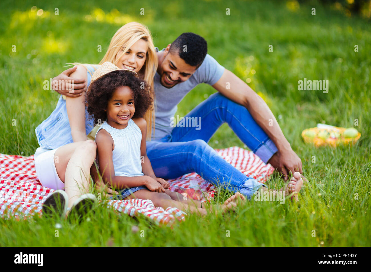 Picture of lovely couple with their daughter having picnic Stock Photo ...