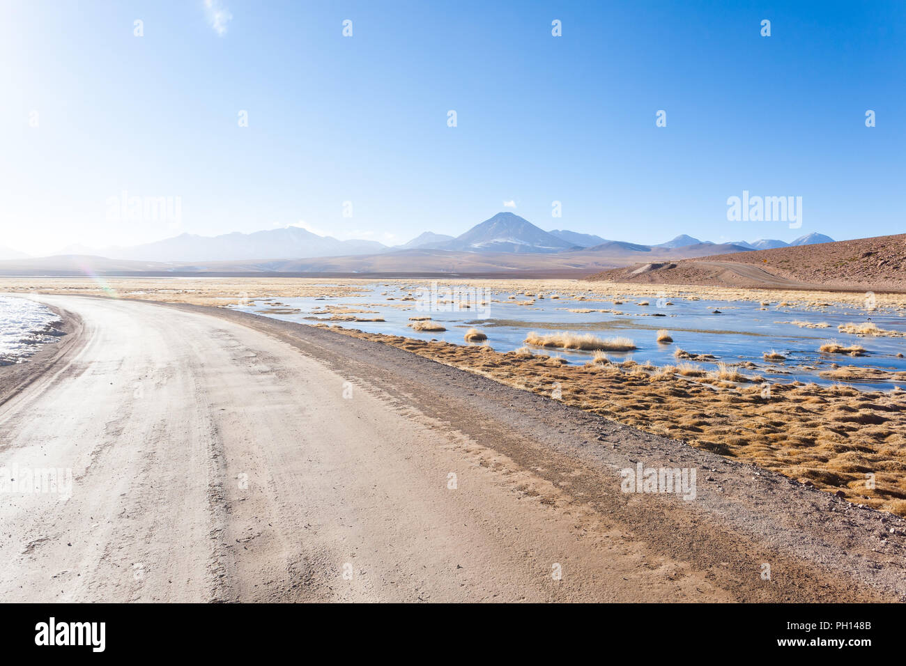 Chilean landscape, dirt road and Licancabur volcano. Chile panorama ...
