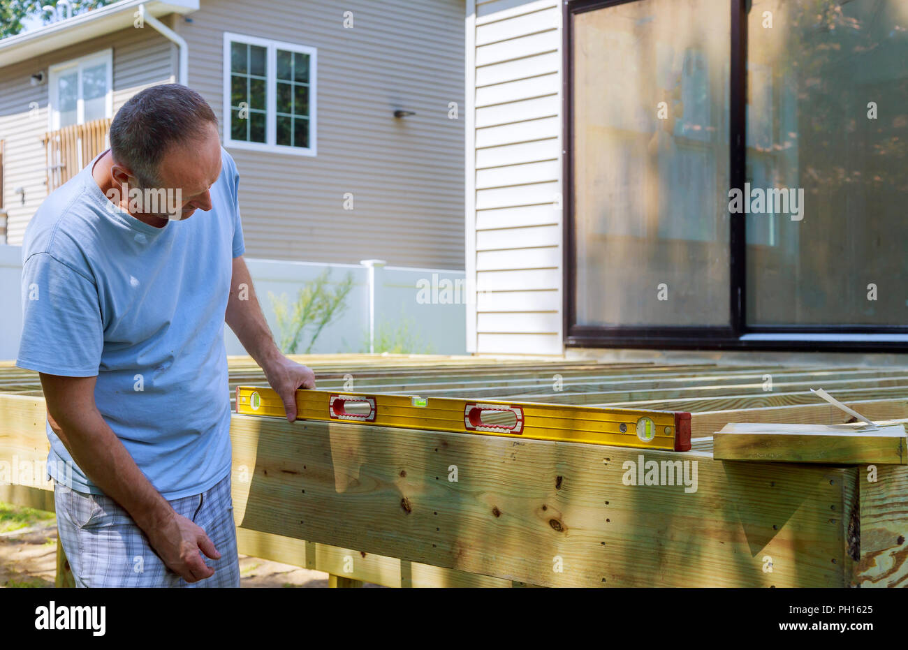 Close up of exterior timber decking building a backyard deck with ...