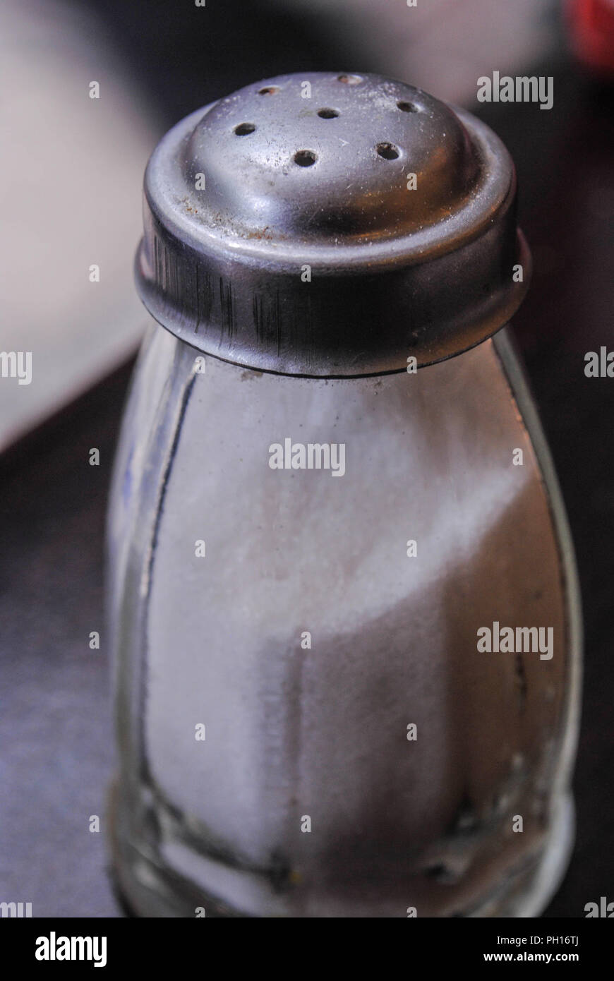 Old salt shaker in a restaurant table Stock Photo - Alamy